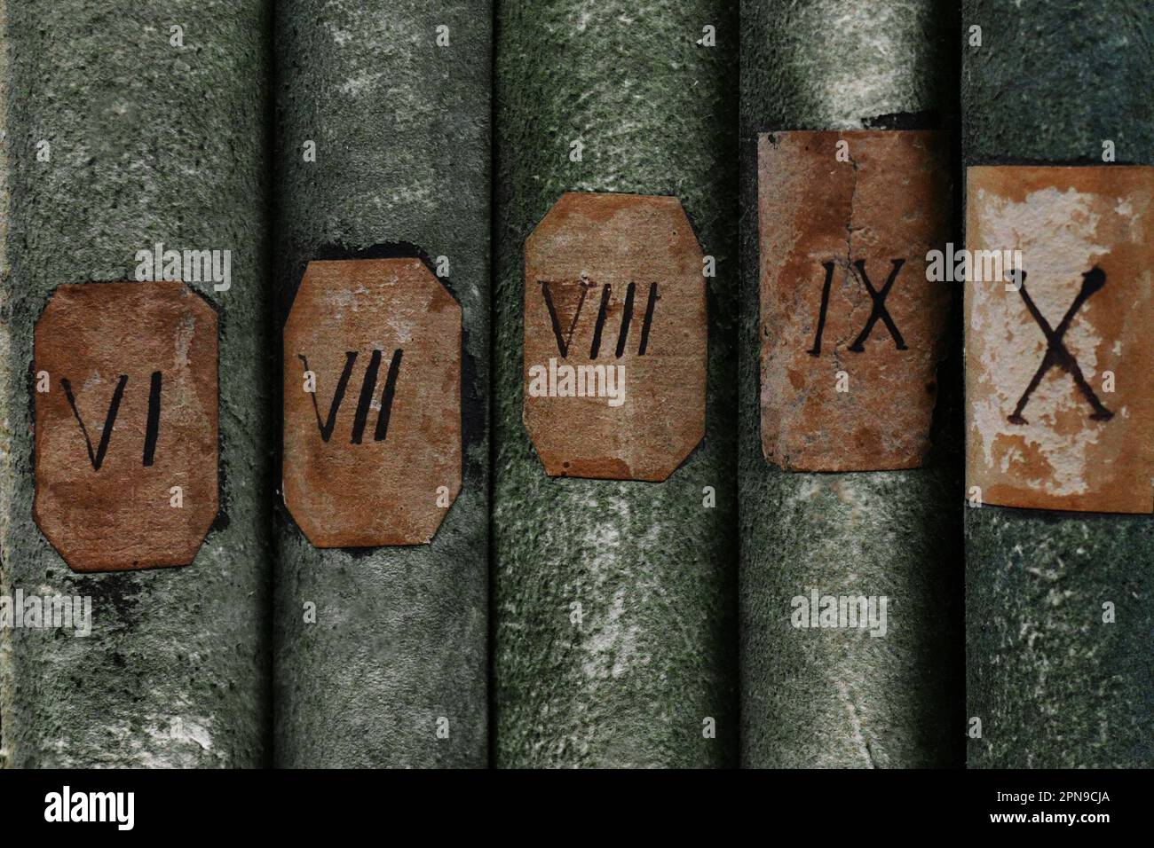 Old books with Roman numerals in the library Stock Photo - Alamy