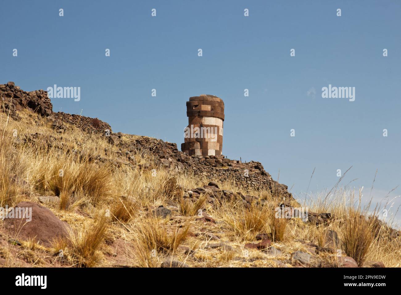 The ruins of a tower-like tomb (called a chullpa) in Sillustani, Puno ...