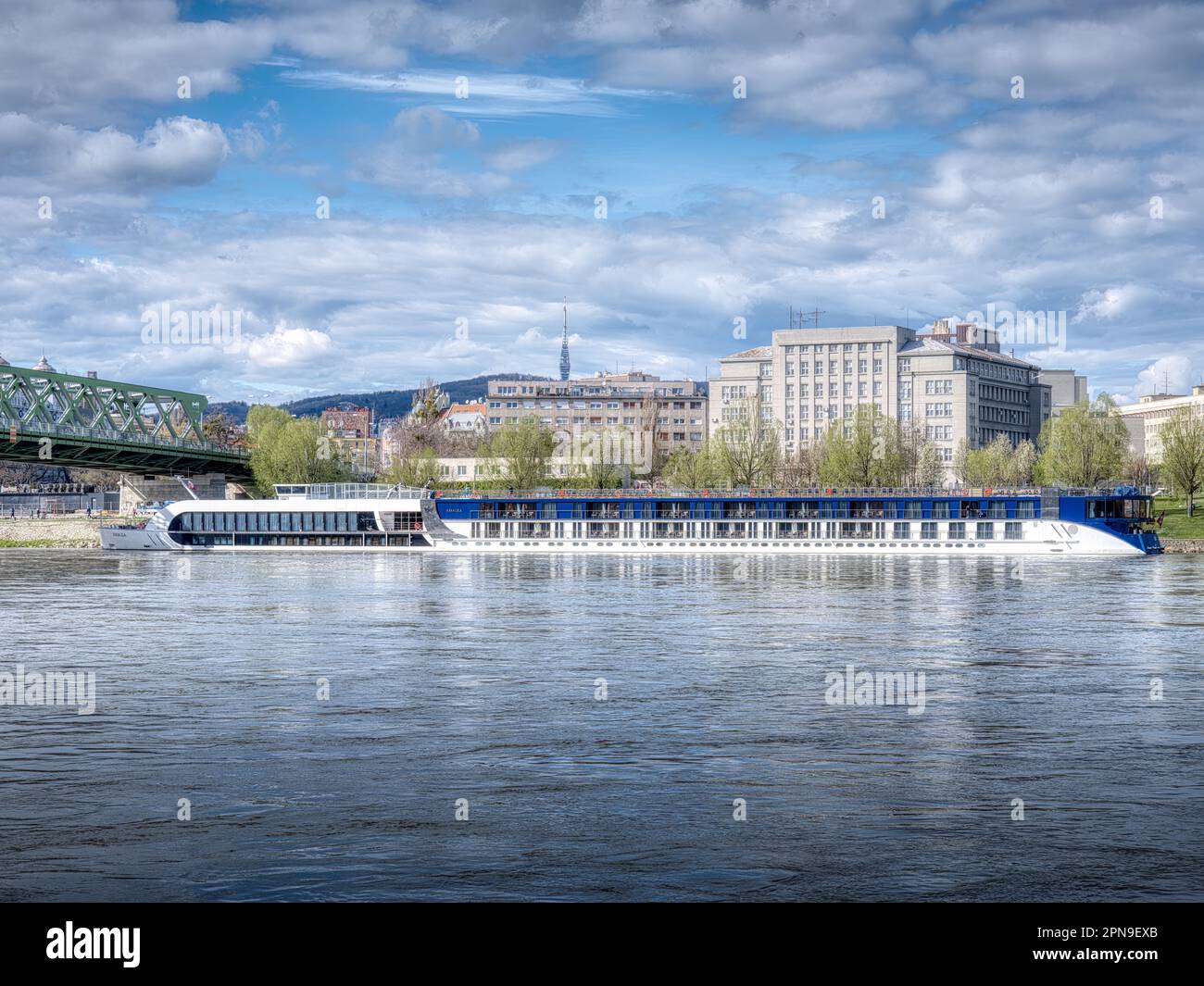 A long white and blue boat on the Danube river in Bratislava Stock ...