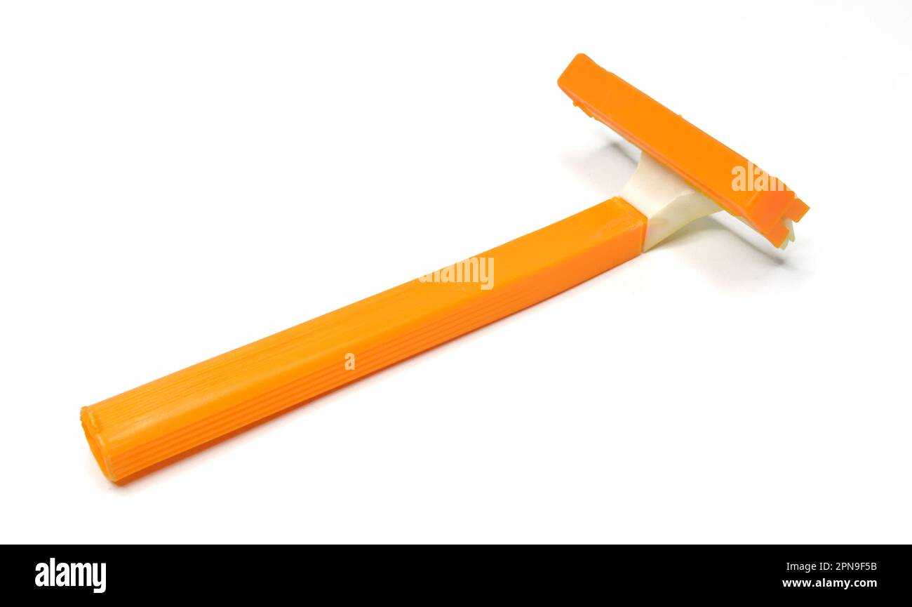 Retro Orange and white plastic razor on white background Stock Photo ...
