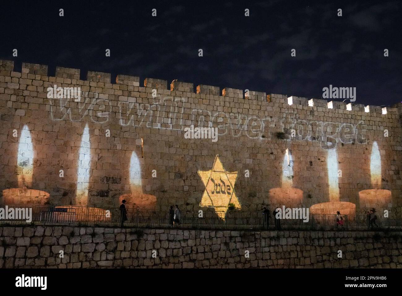 An image of a yellow Star of David that reads "Jude," or Jew in German ...