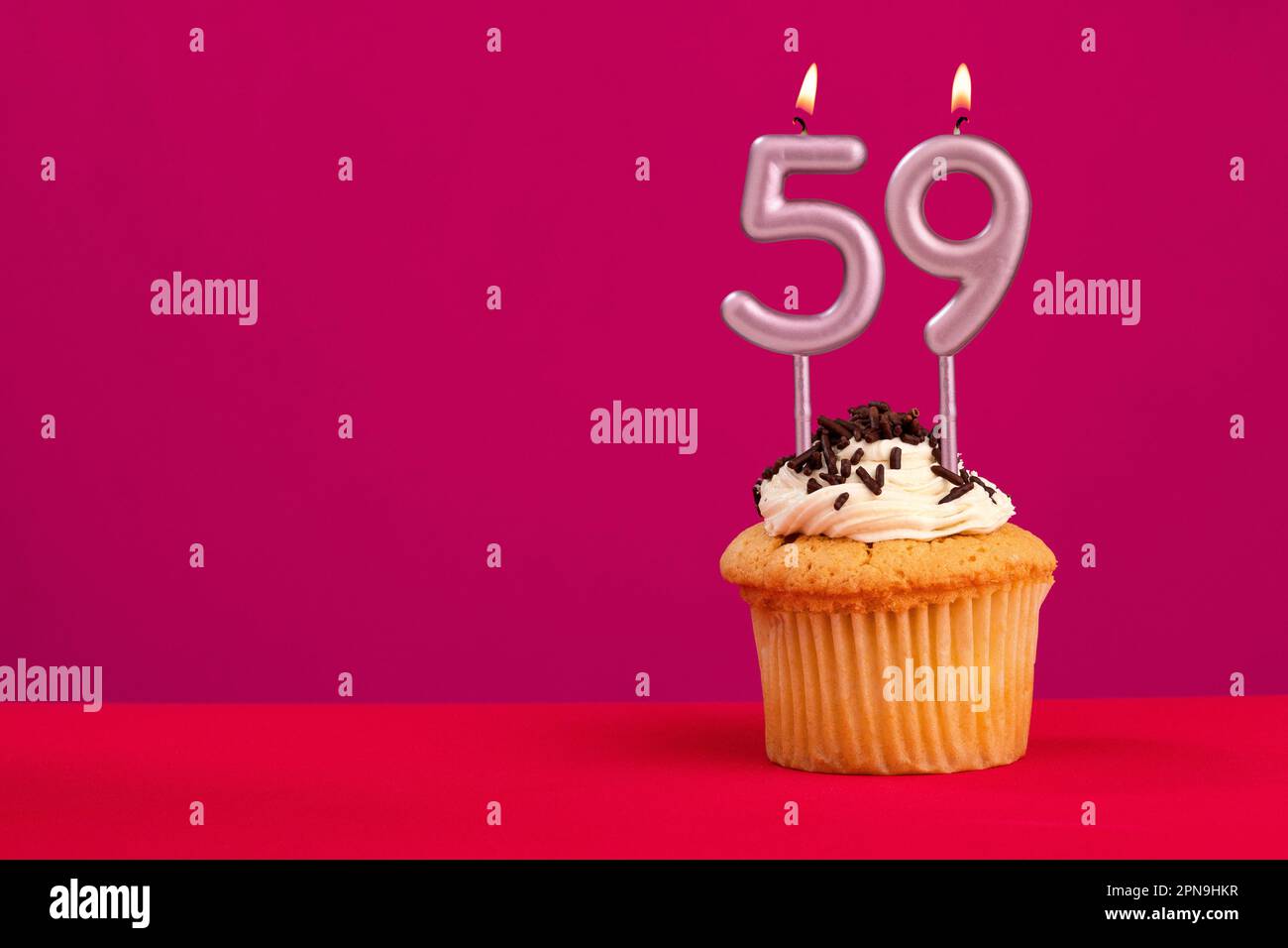 Birthday cake with candle number 59 - Rhodamine Red foamy background ...