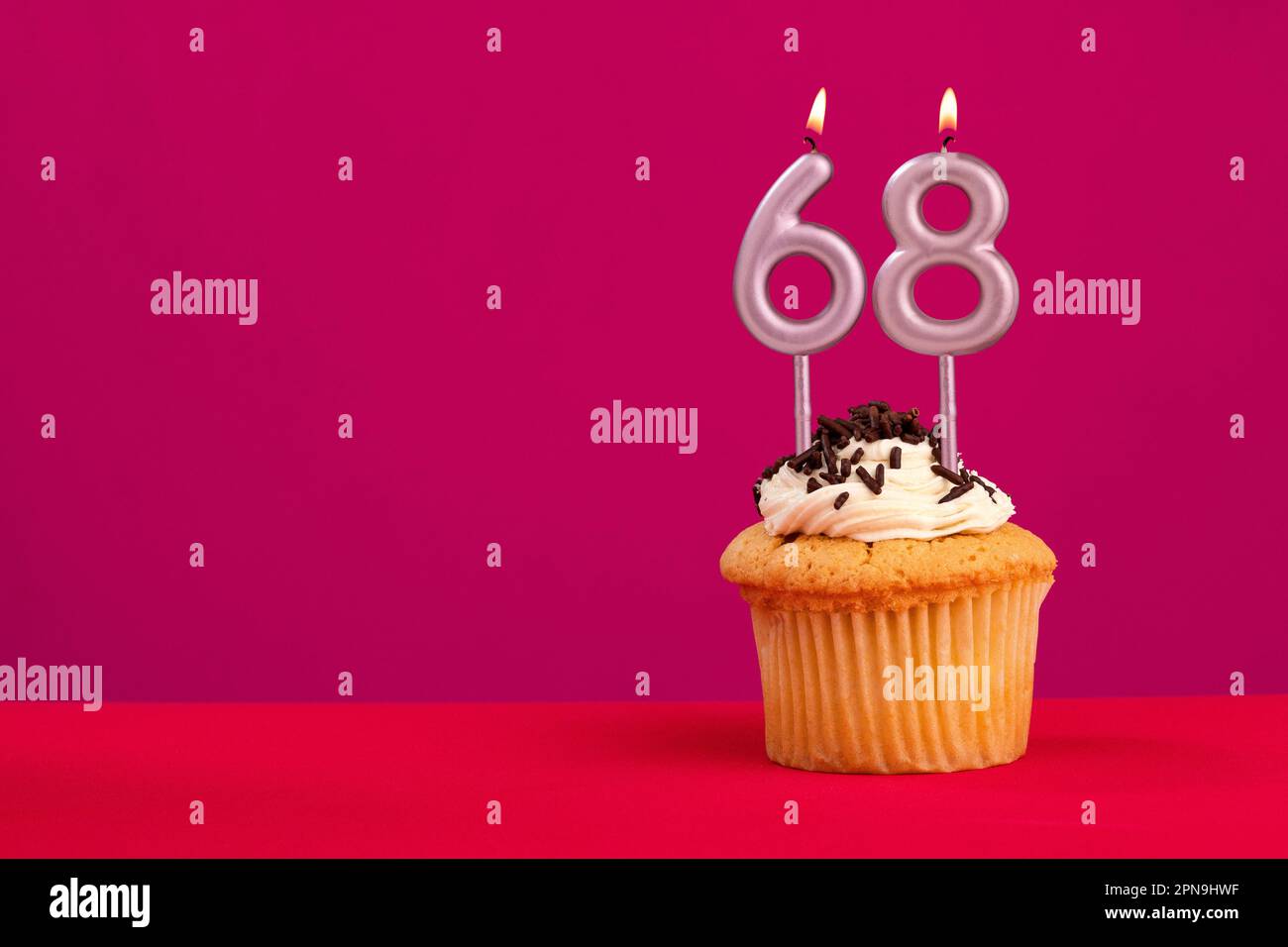 Candle number 68 - Cake birthday in rhodamine red background Stock ...