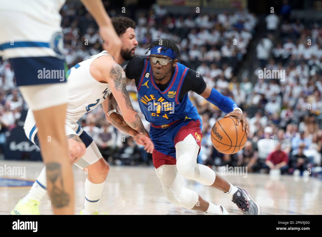 Denver Nuggets guard Reggie Jackson (7) and Minnesota Timberwolves ...
