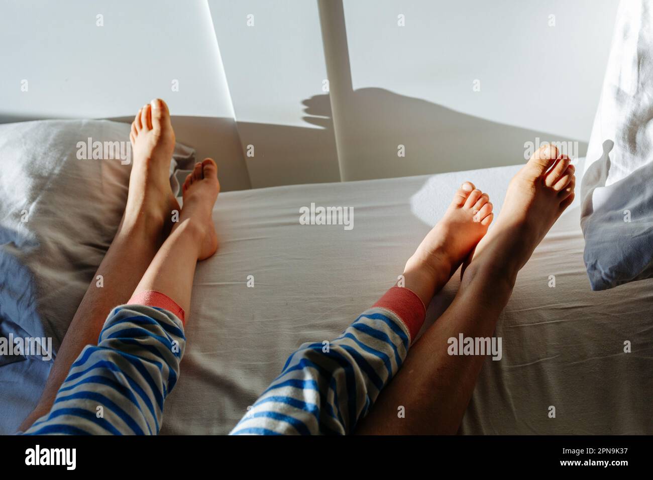 Feet child in bed morning hi-res stock photography and images - Alamy