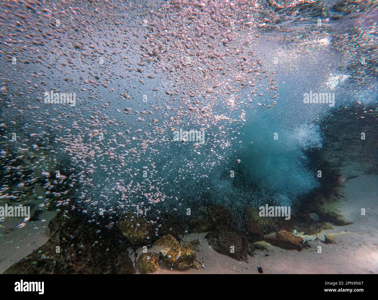 Breathtaking underwater waterfall with sand bottom and millions of ...