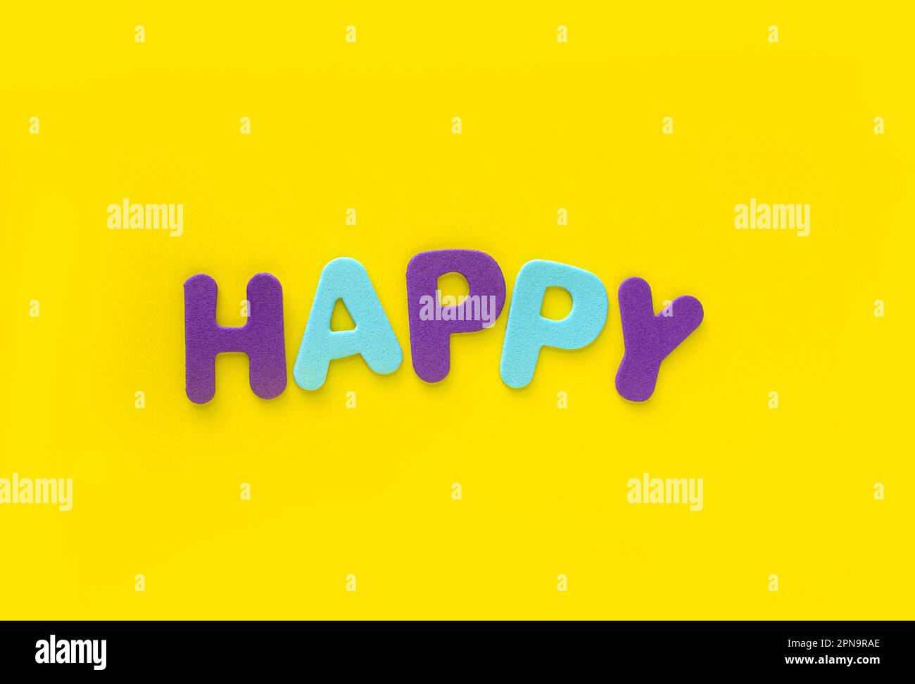 Happy alphabet letter on yellow background with copy space. Celebration ...