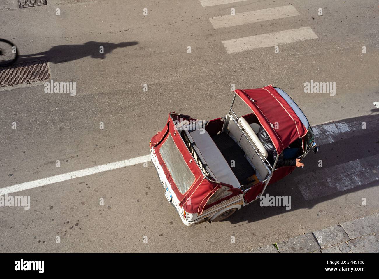 Top view of the traditional 3-wheeled Ape taxi parked in the center of ...
