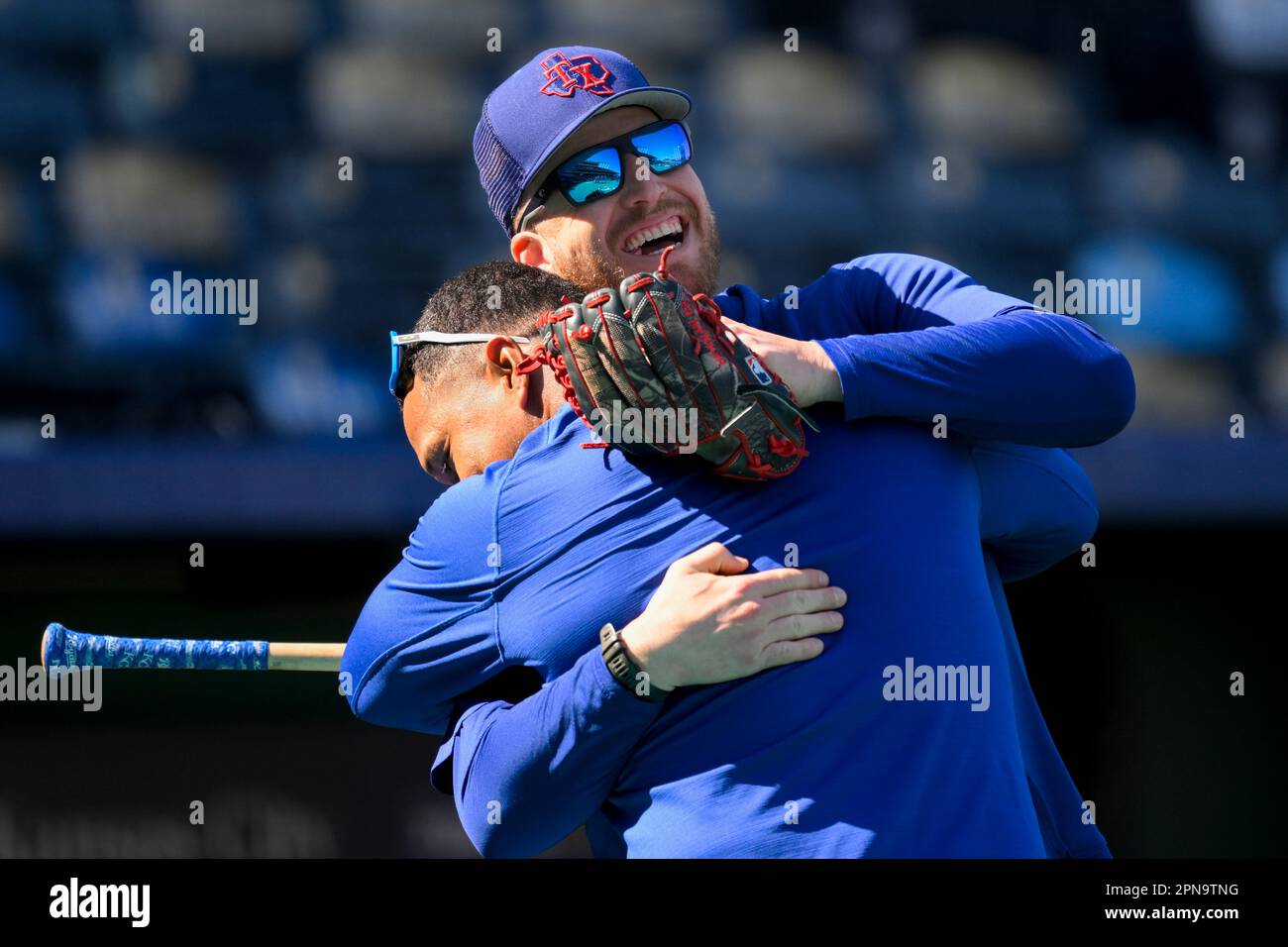 Texas Rangers relief pitcher Will Smith, right, hugs Kansas City Royals ...