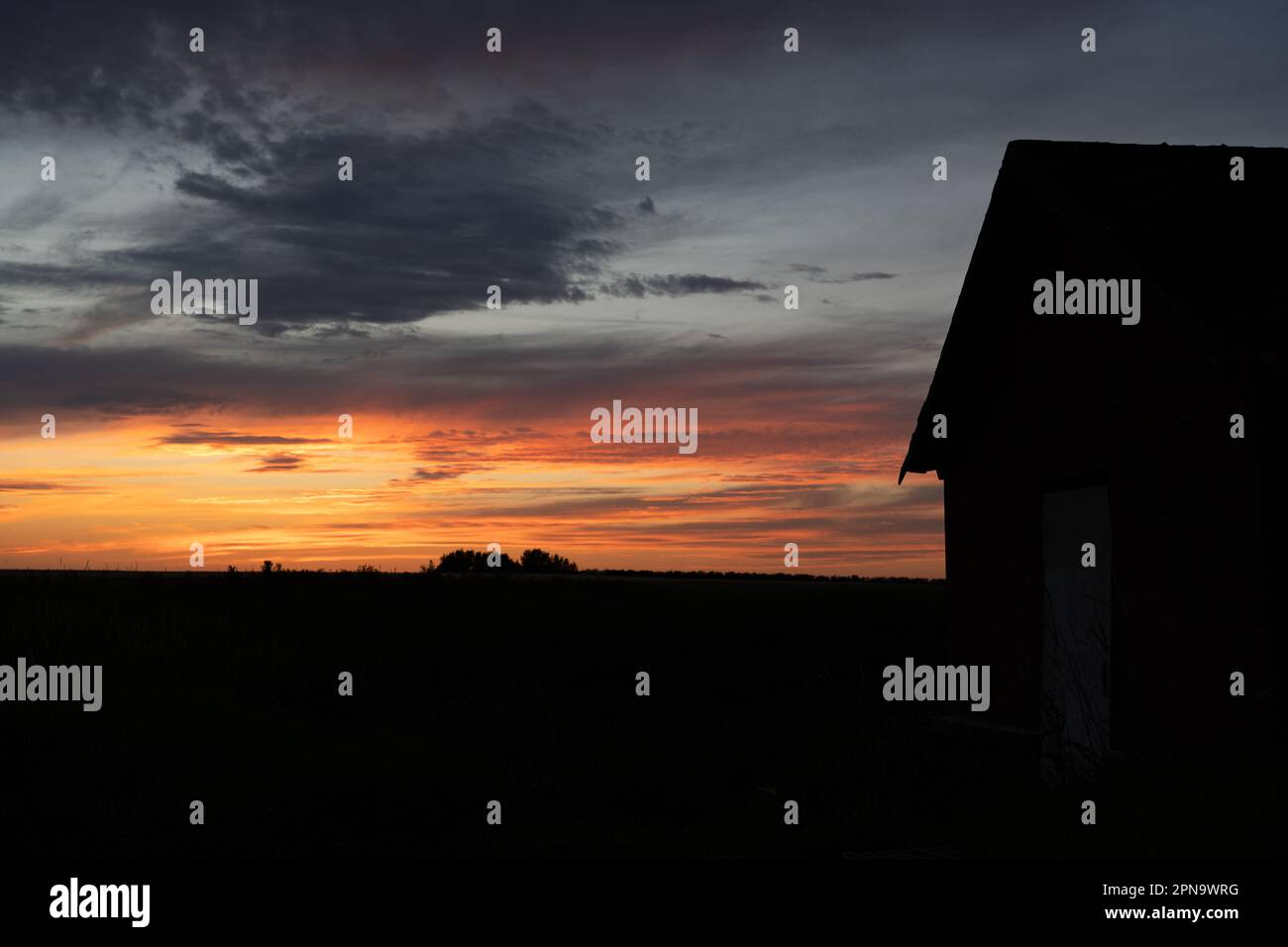 Old Rustic shed silhouette sunset shot under a dramatic sky on the ...
