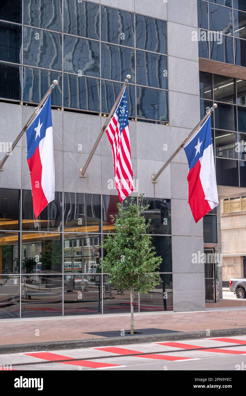 American and Texas flags on office building in downtown Houston Stock ...