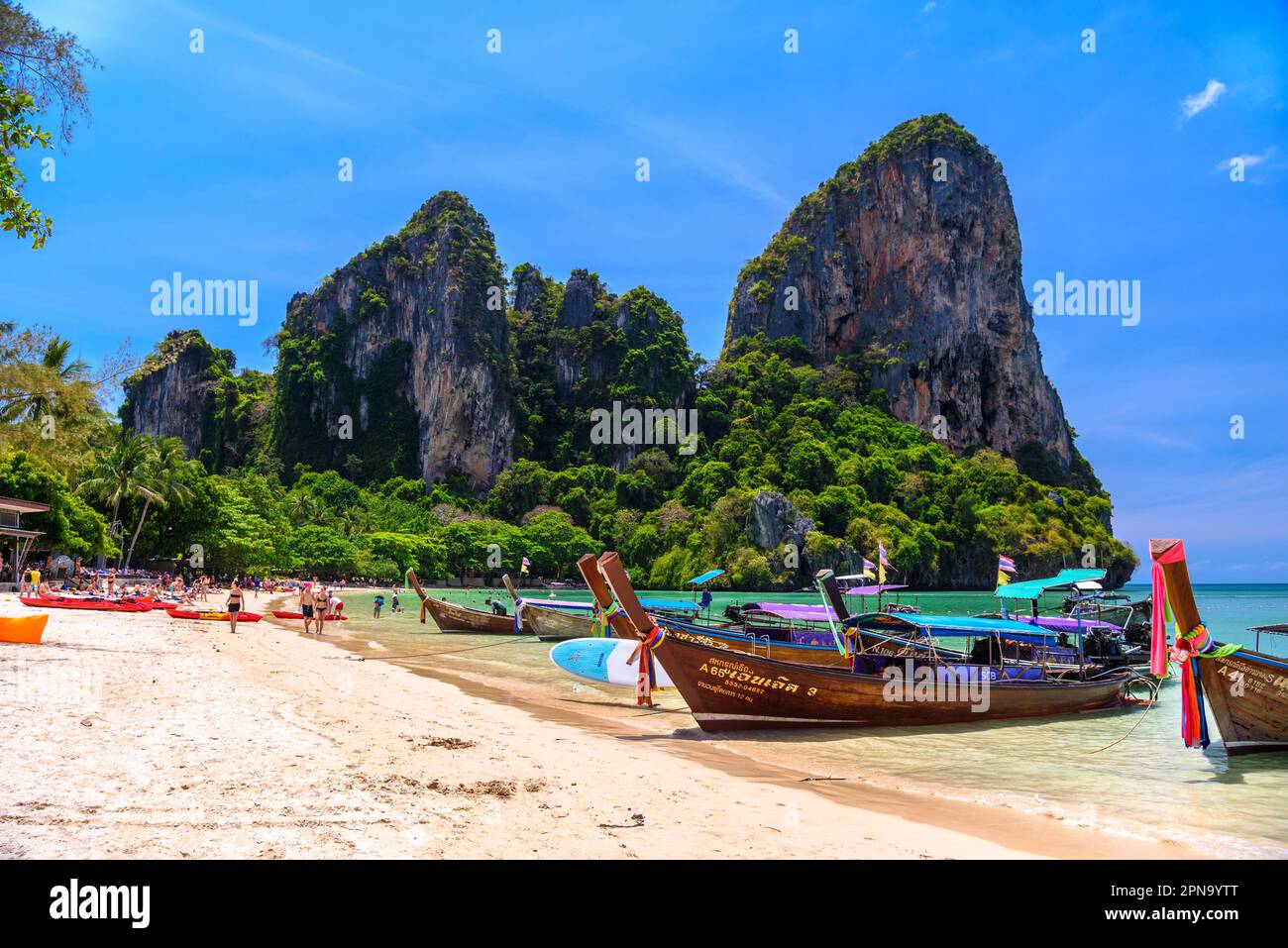 KRABI, THAILAND- MARCH 2018: Long tail boats and rocks on Railay beach west, Ao Nang, Krabi ...