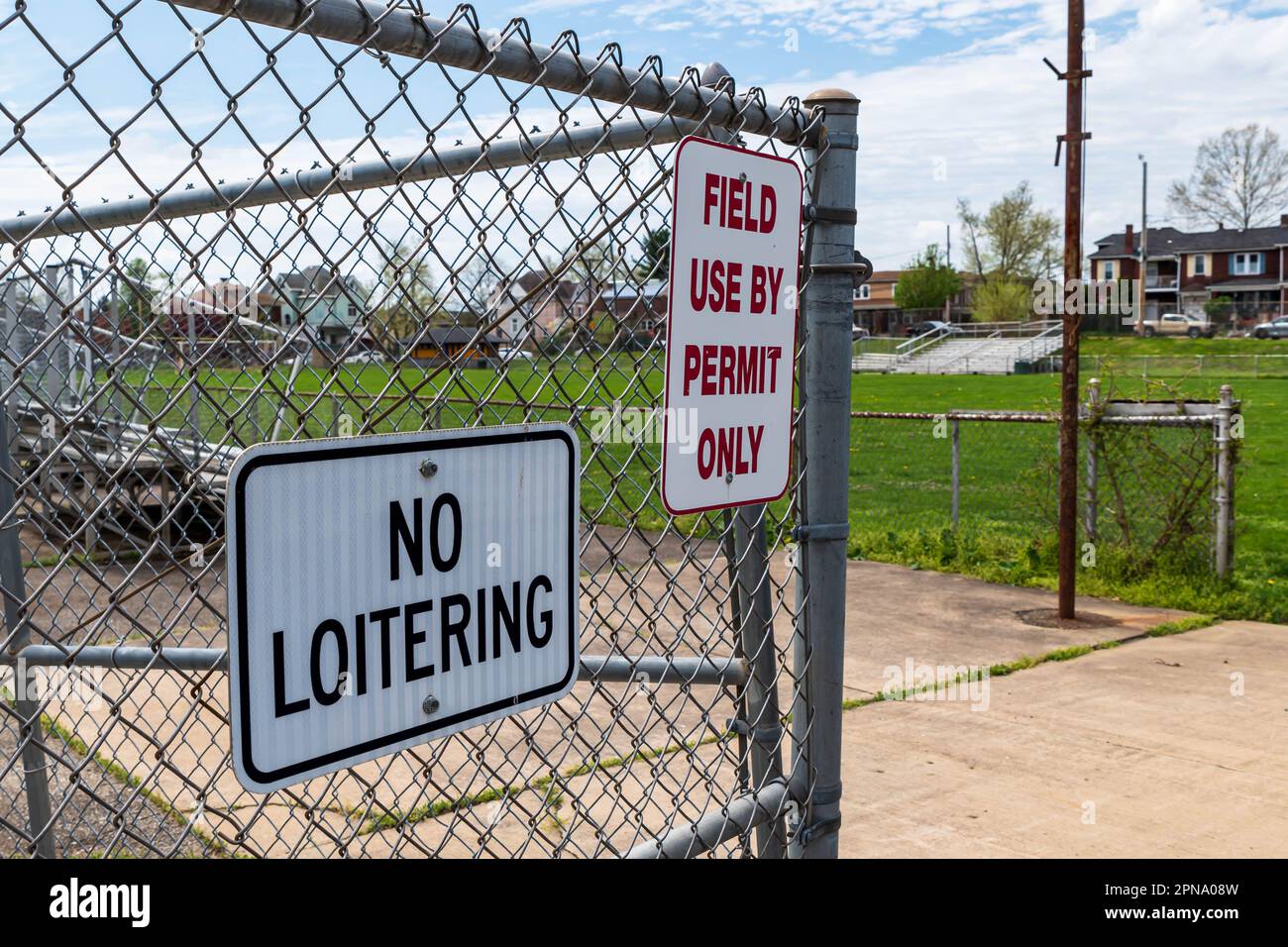 Signs on a fence at a football field in Swissvale, Pennsylvania, USA ...