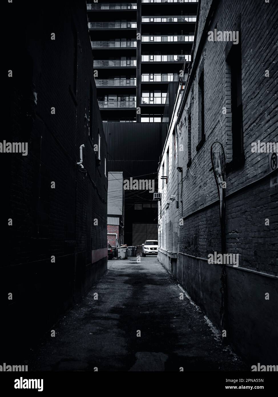 Dark Alley with Glimmer of Light Stock Photo - Alamy