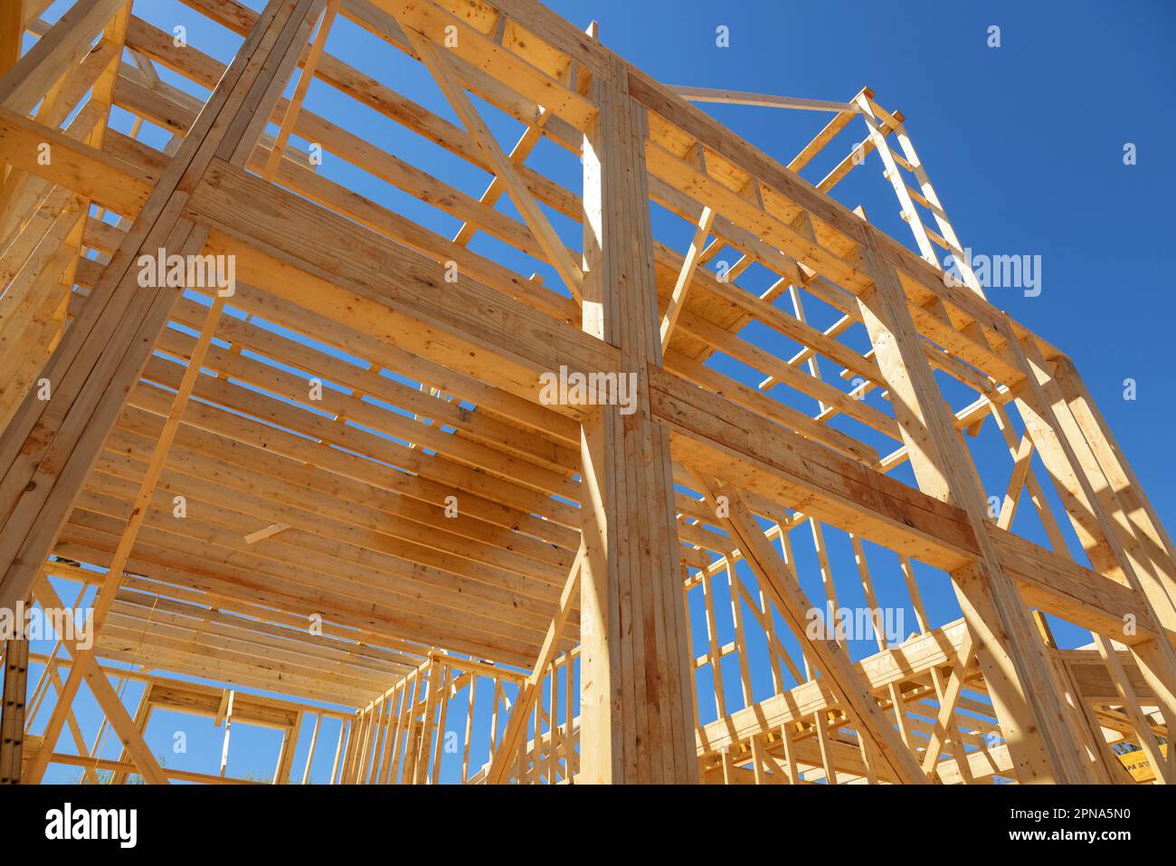 The wooden beams sticks that being used to build a new house are being ...