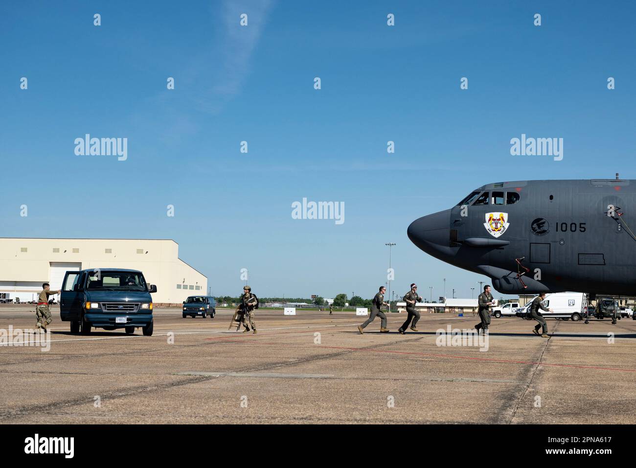Aircrew with the 69th Bomb Squadron rush to begin pre-flight checks ...