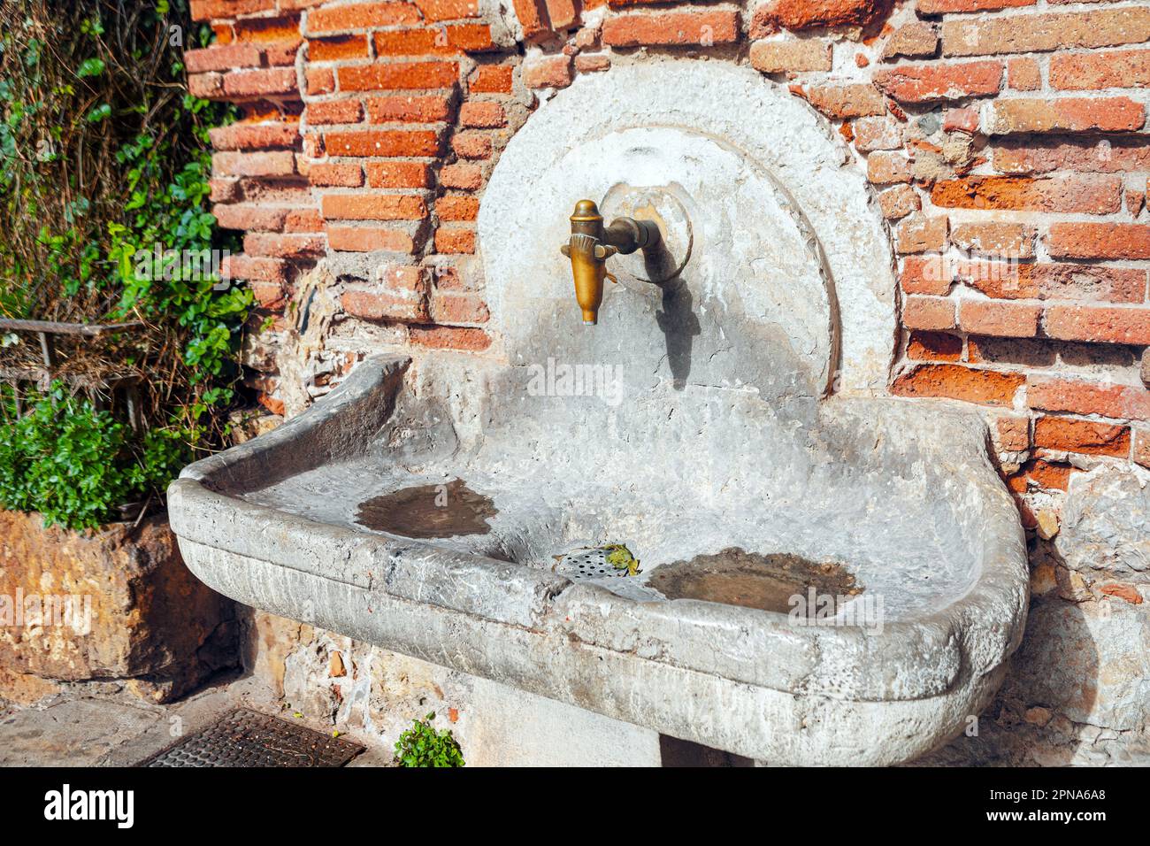 Outdoor faucet for drinking water . Ancient stone faucet Stock Photo ...