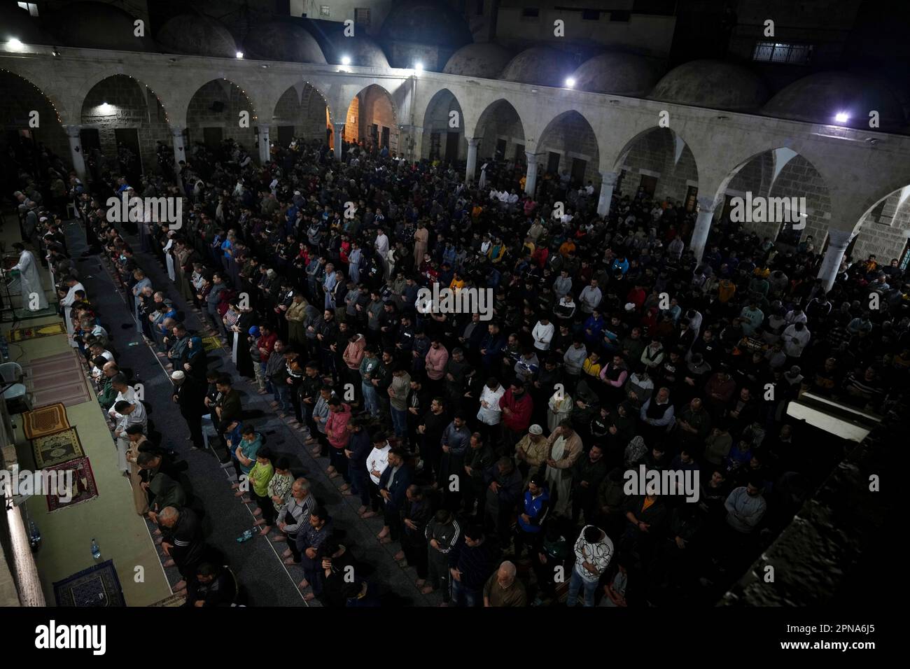 Palestinian Muslim worshippers pray during Laylat al-Qadr, also known ...