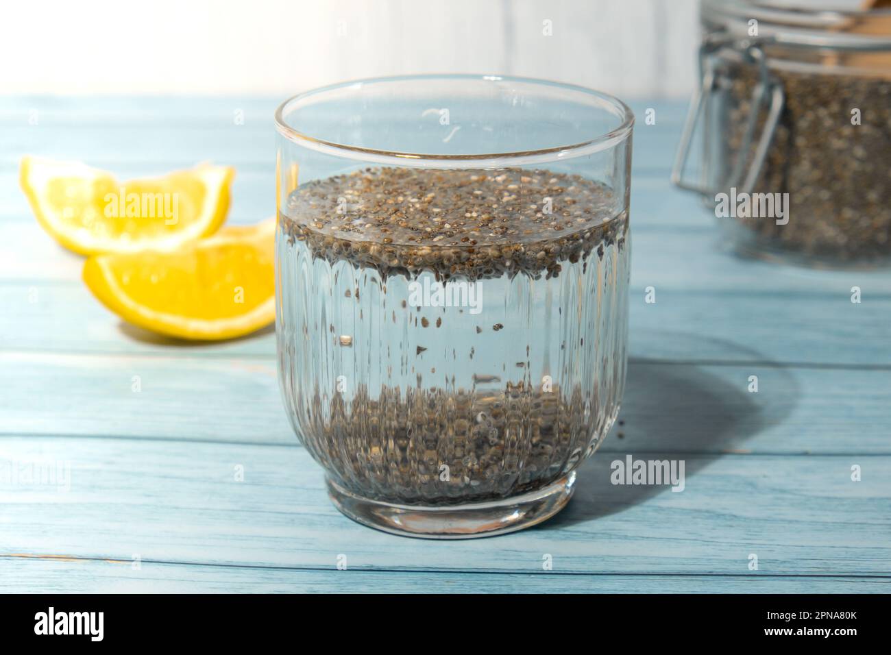 Preparing superfood water drink rich in Omega 3 fatty acids. Pouring ...