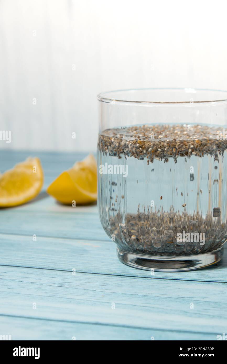 Preparing superfood water drink rich in Omega 3 fatty acids. Pouring ...