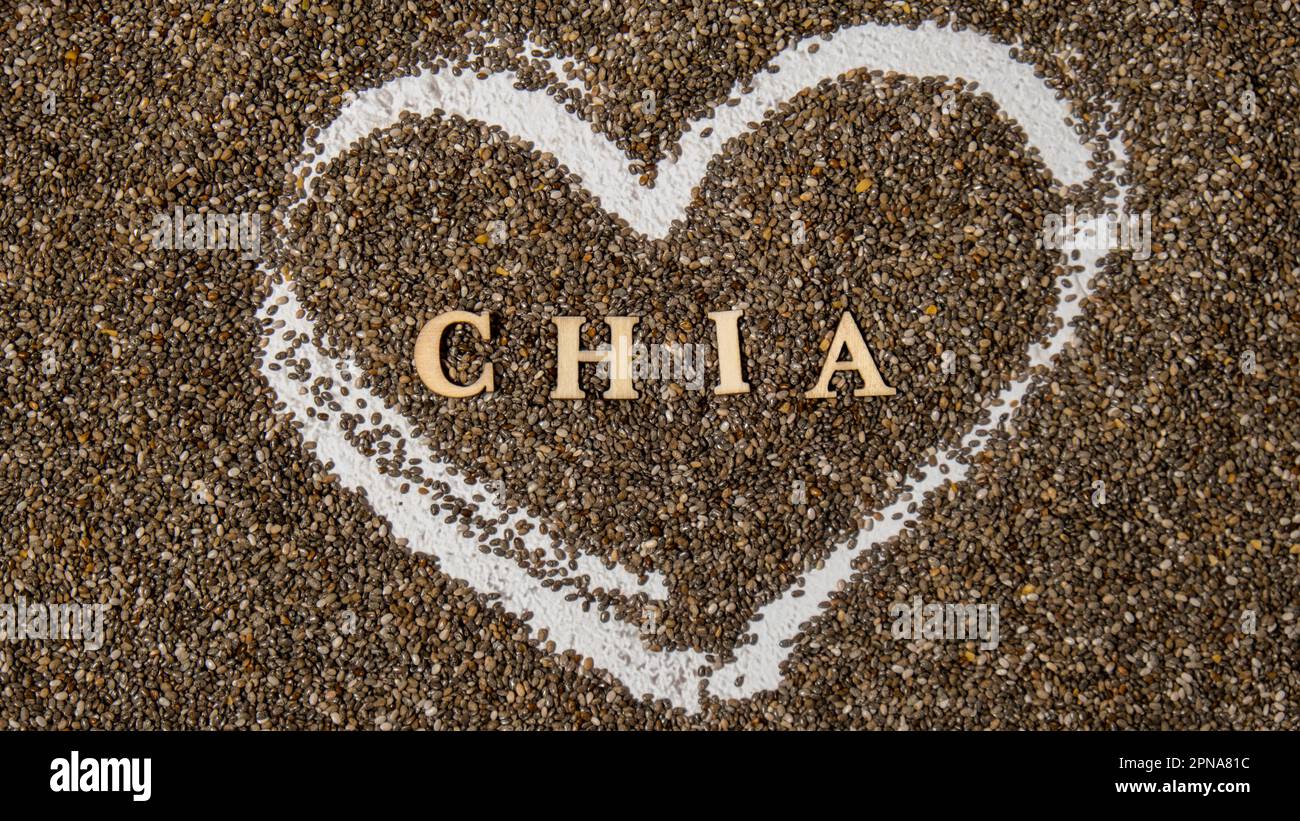 Heart made of chia seeds with word CHIA inside background. Healthy ...