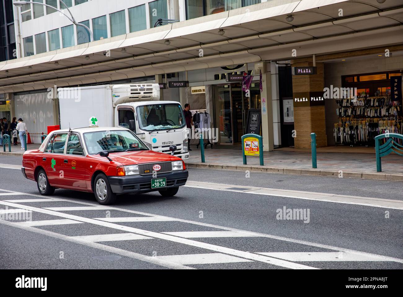 April 2023, traditional Japanese taxi a Toyota Crown four door saloon vehicle on the streets of ...