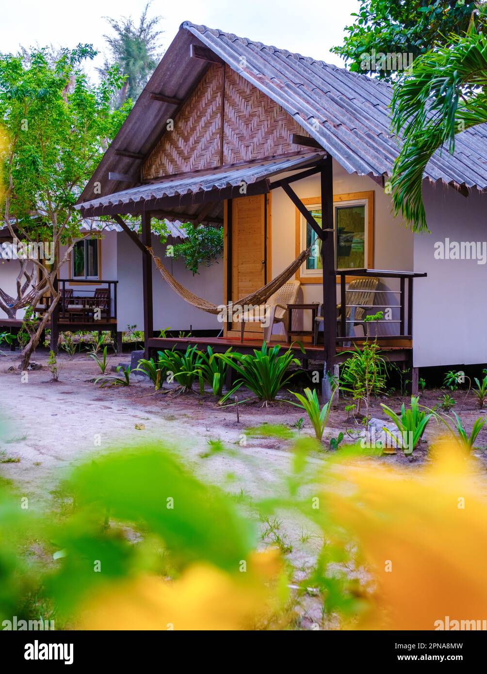 bamboo hut bungalows on the beach in Thailand Stock Photo - Alamy