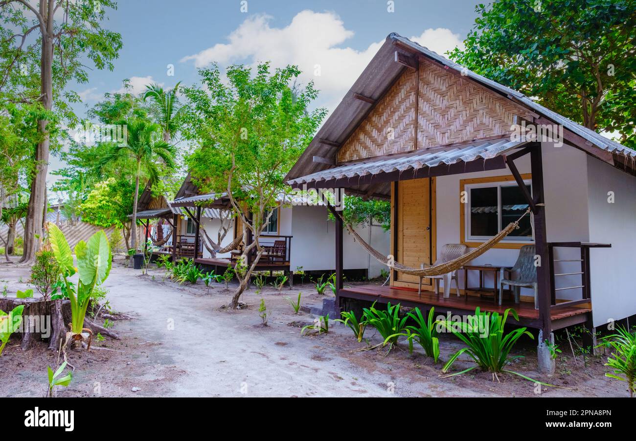 bamboo hut bungalows on the beach in Thailand Stock Photo - Alamy