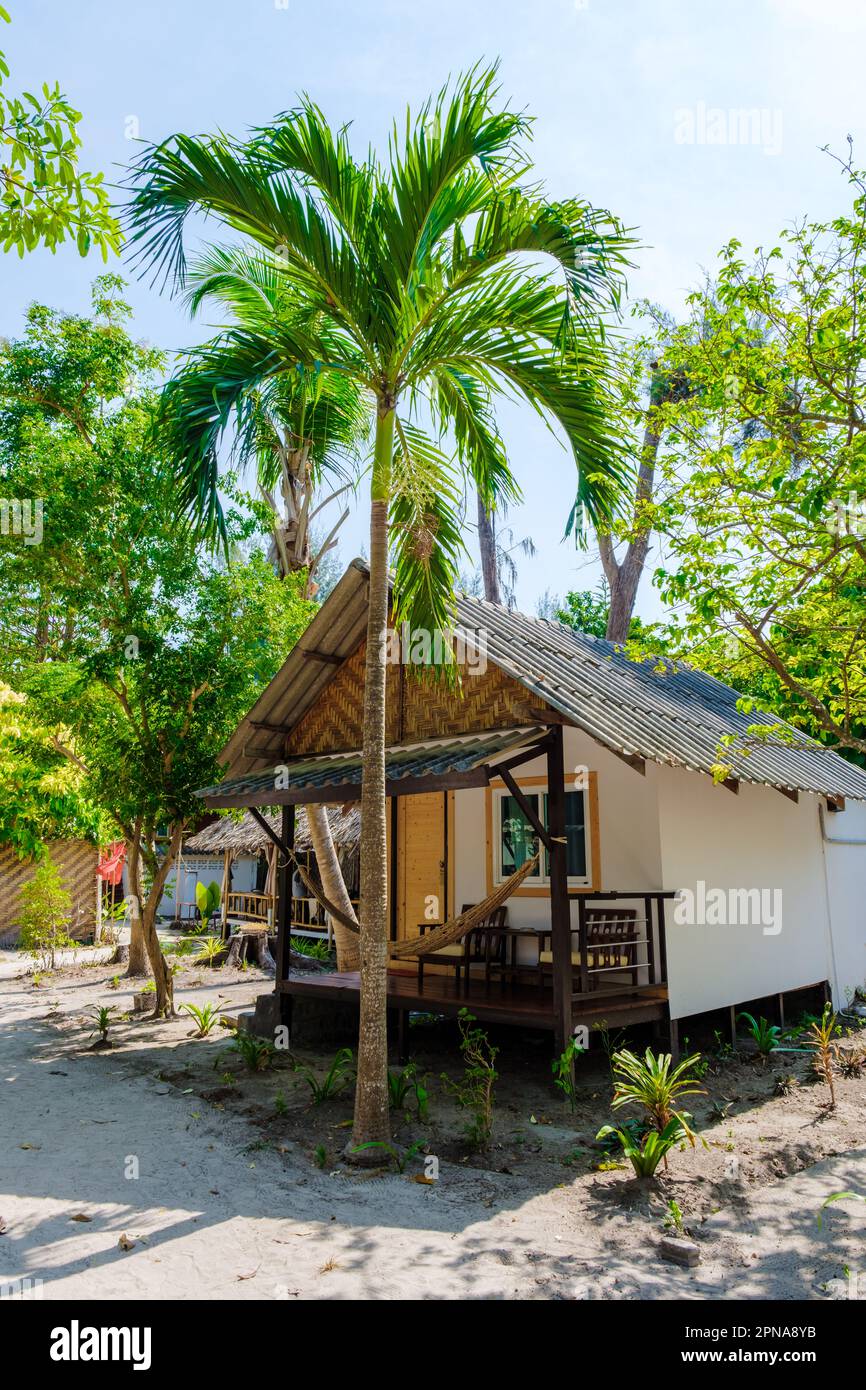 bamboo hut bungalows on the beach in Thailand Stock Photo - Alamy