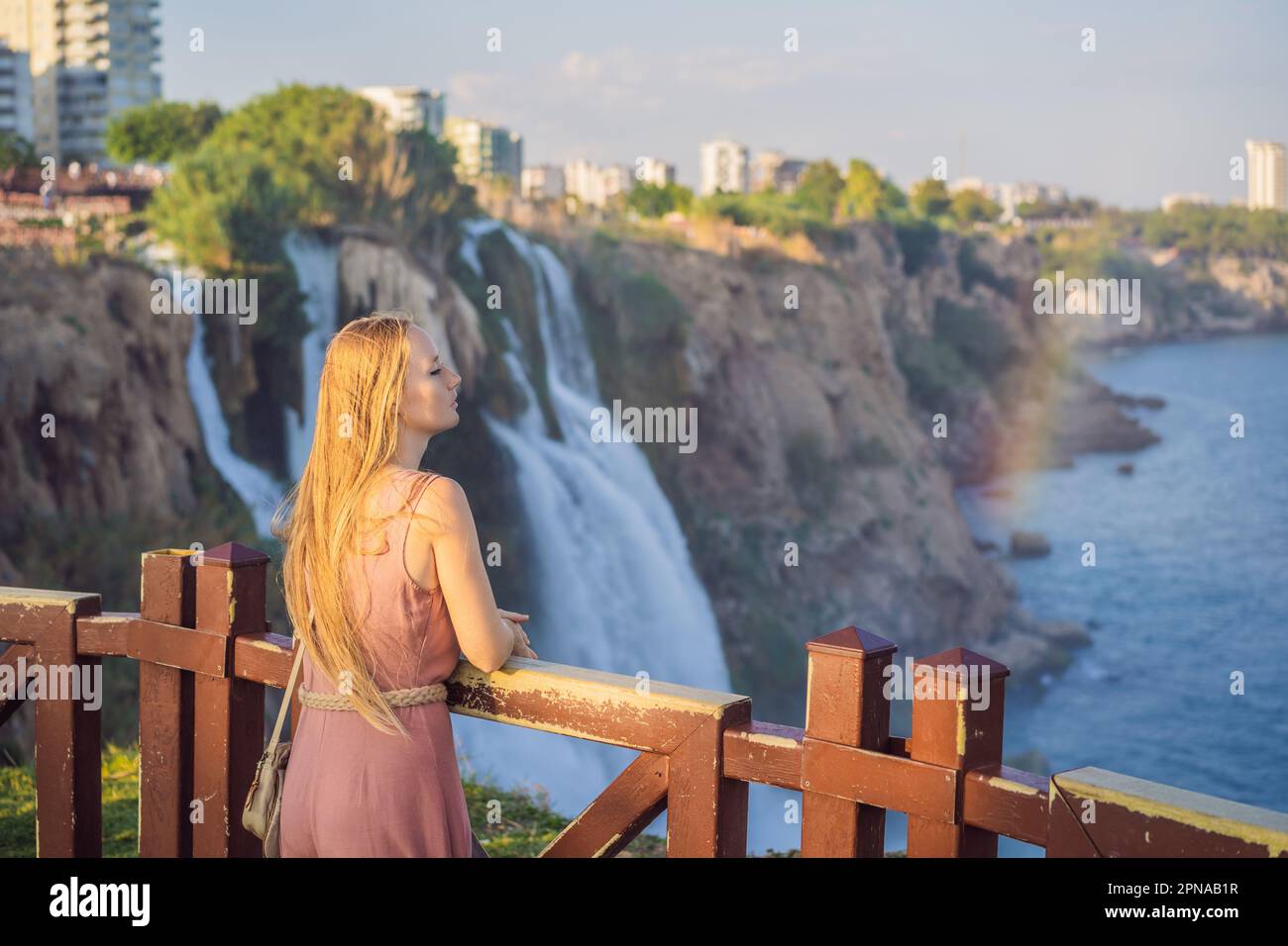 Beautiful woman with long hair on the background of Duden waterfall in ...