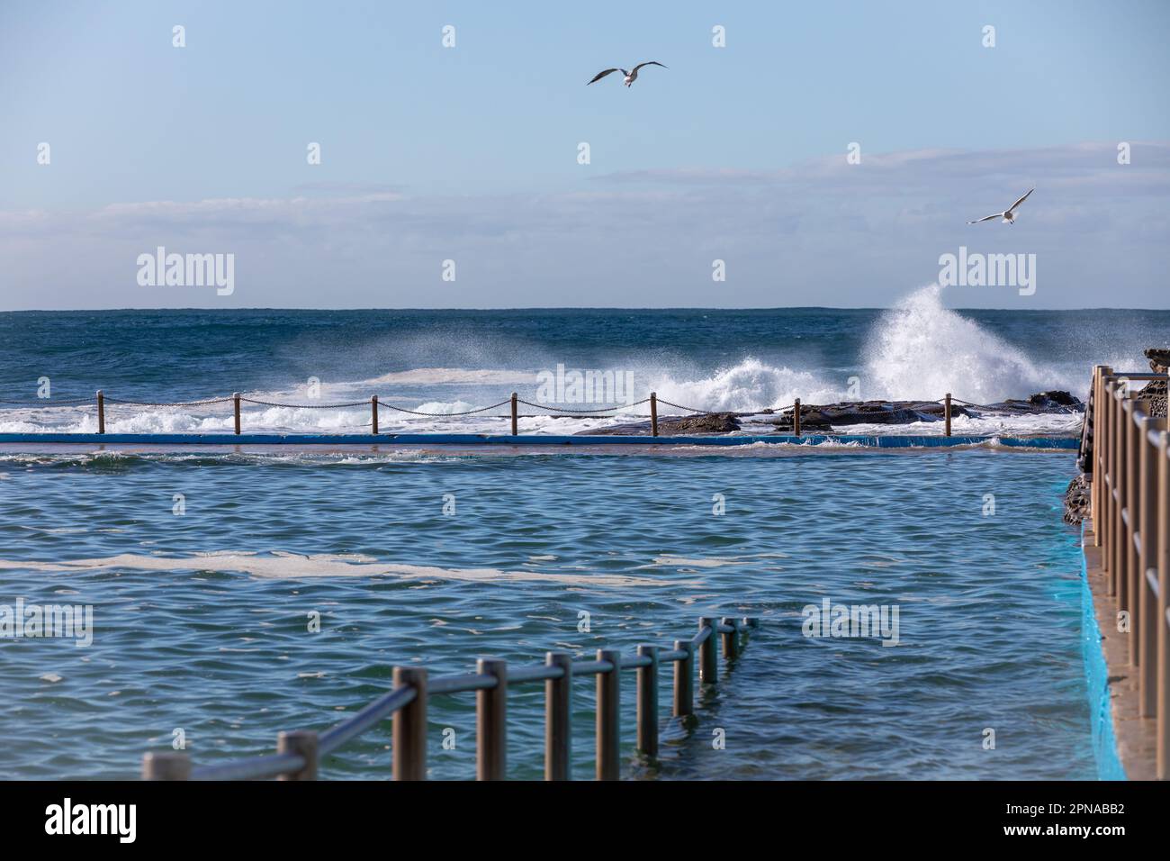 Waves crashing over Dee Why Beach Rockpools, ocean swimming pools Stock ...