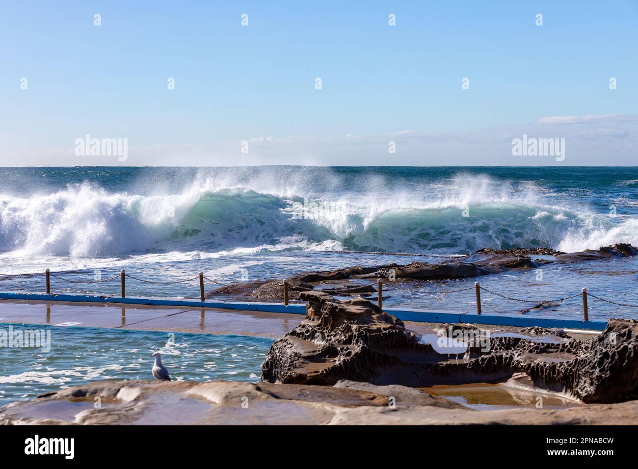Waves crashing over Dee Why Beach Rockpools, ocean swimming pools Stock ...