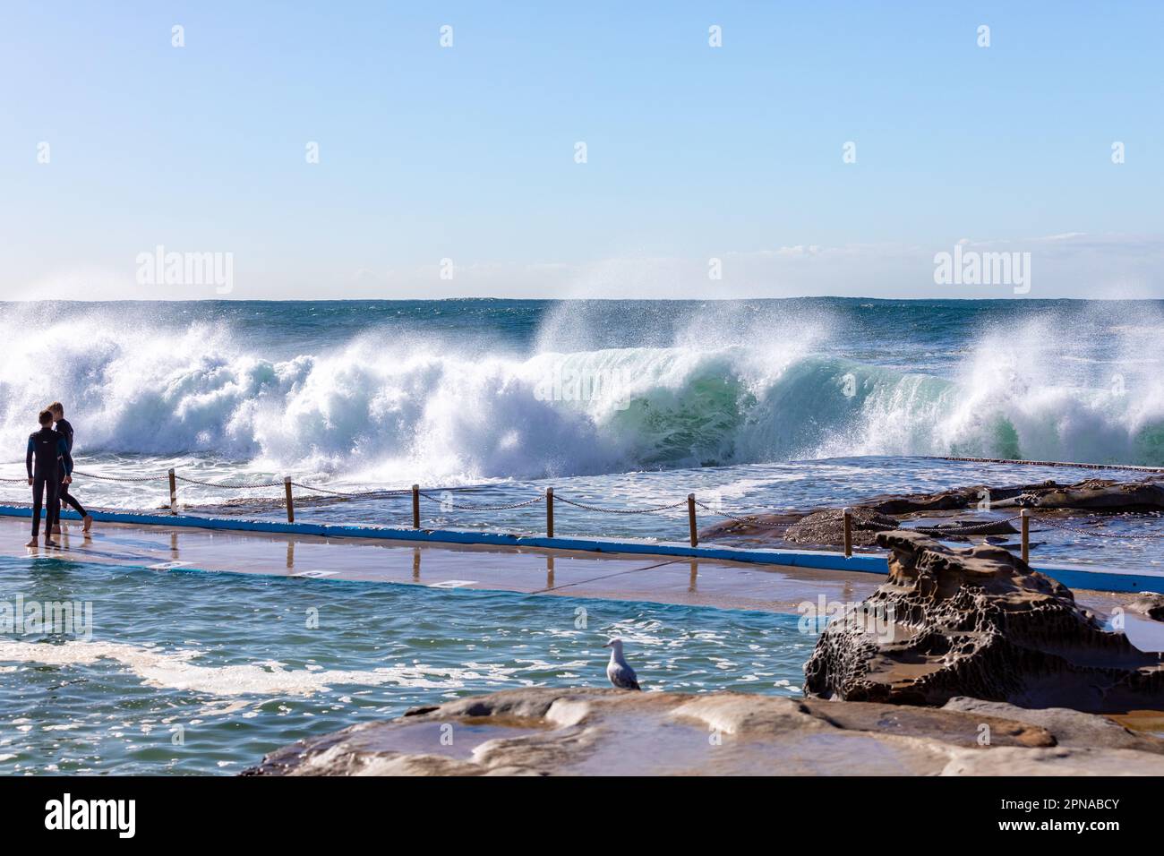 Waves crashing over Dee Why Beach Rockpools, ocean swimming pools Stock ...