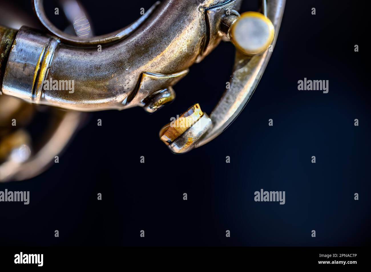 Selective focus on a water key of an aged wind instrument trumpet Stock ...