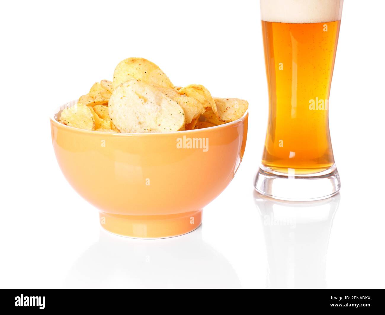 bowl of potato chips or crisps and a glass of wheat beer Stock Photo ...