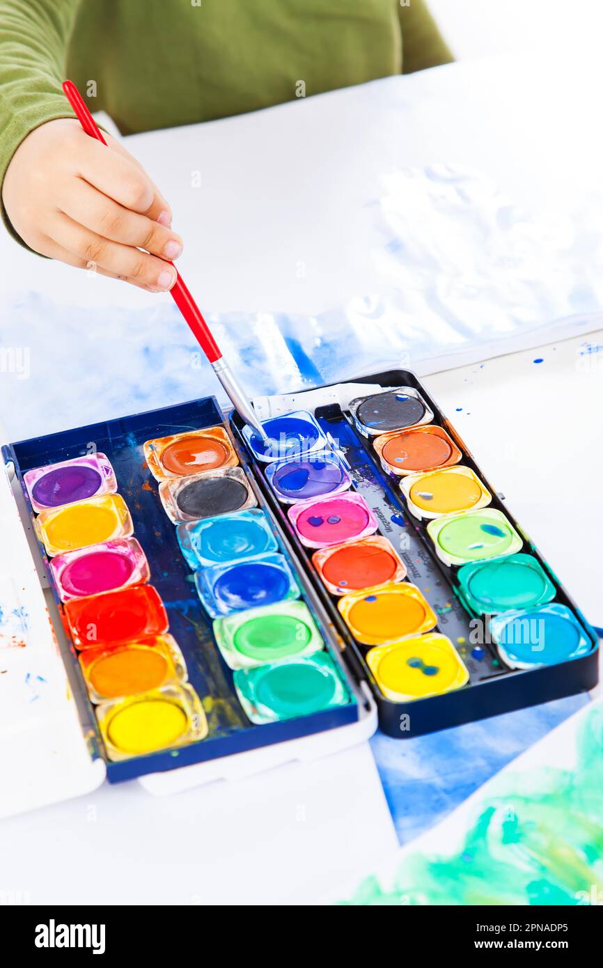 Detail of hands painting with watercolor Stock Photo - Alamy