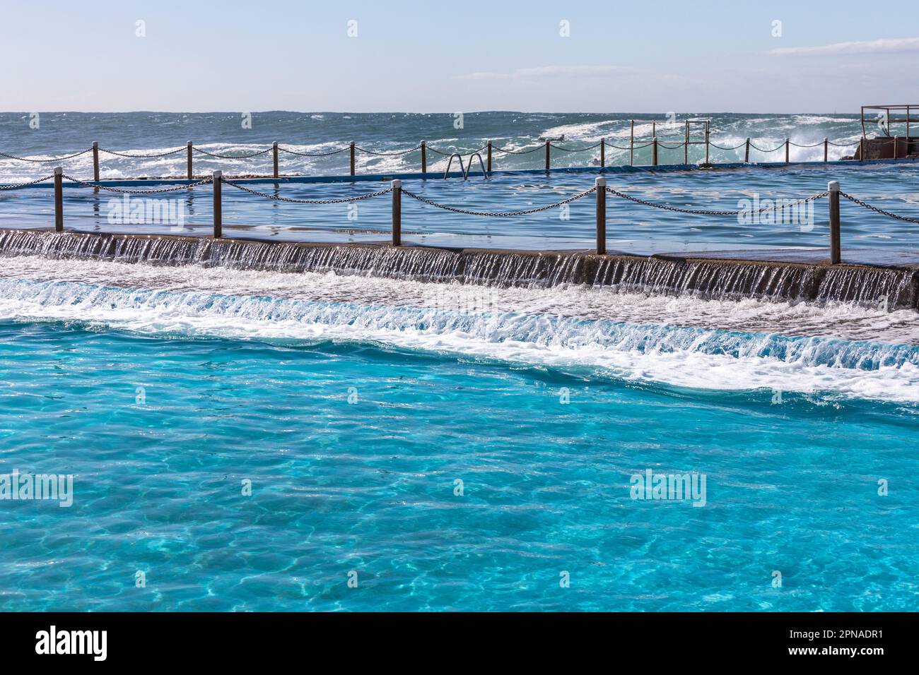 Waves crashing over Dee Why Beach Rockpools, ocean swimming pools Stock ...