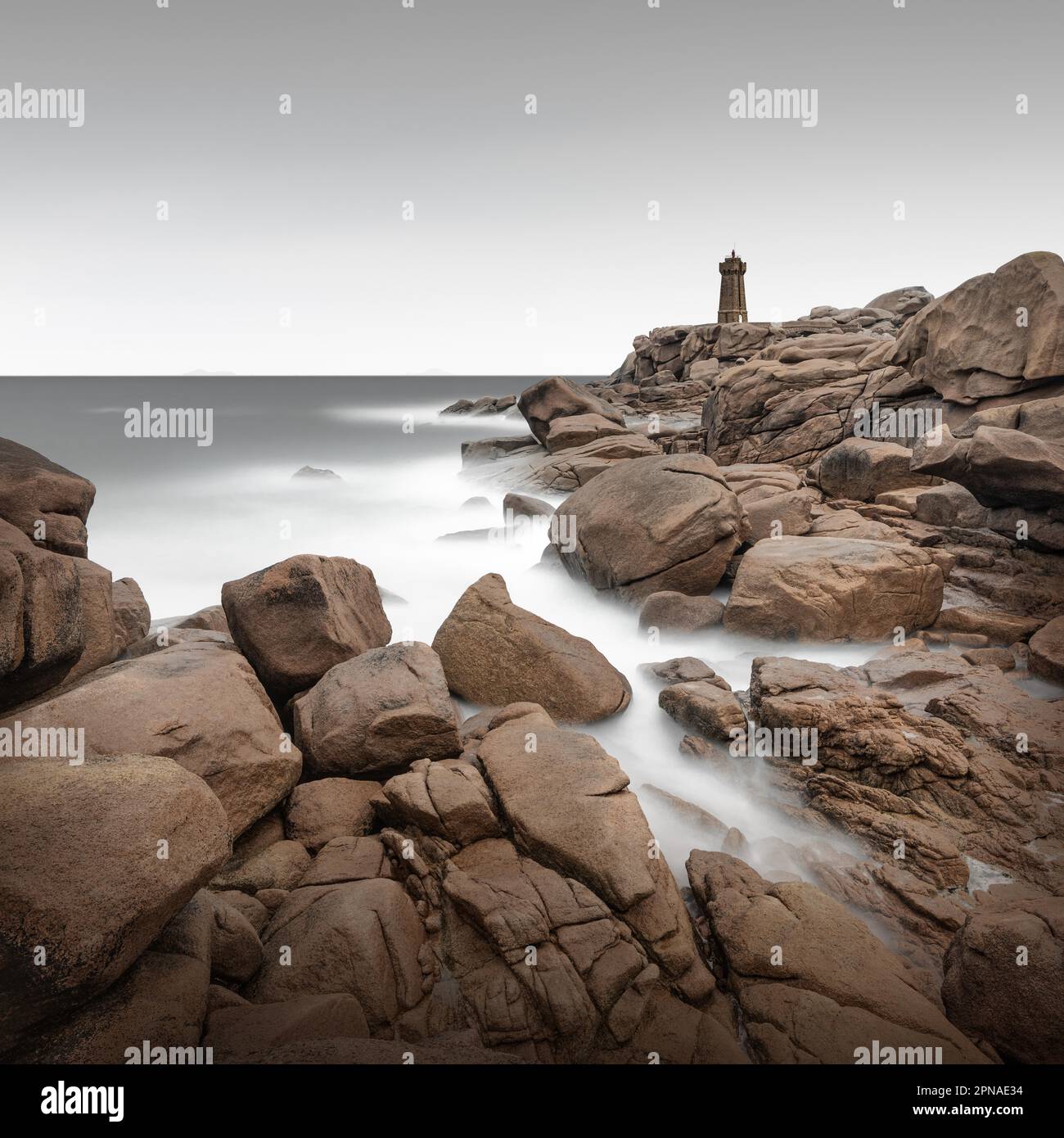 Long exposure of the Phare de Ploumanach lighthouse on the rugged coast ...
