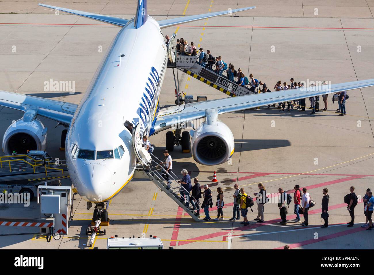 Aircraft of the low-cost airline Ryanair during check-in, passengers ...