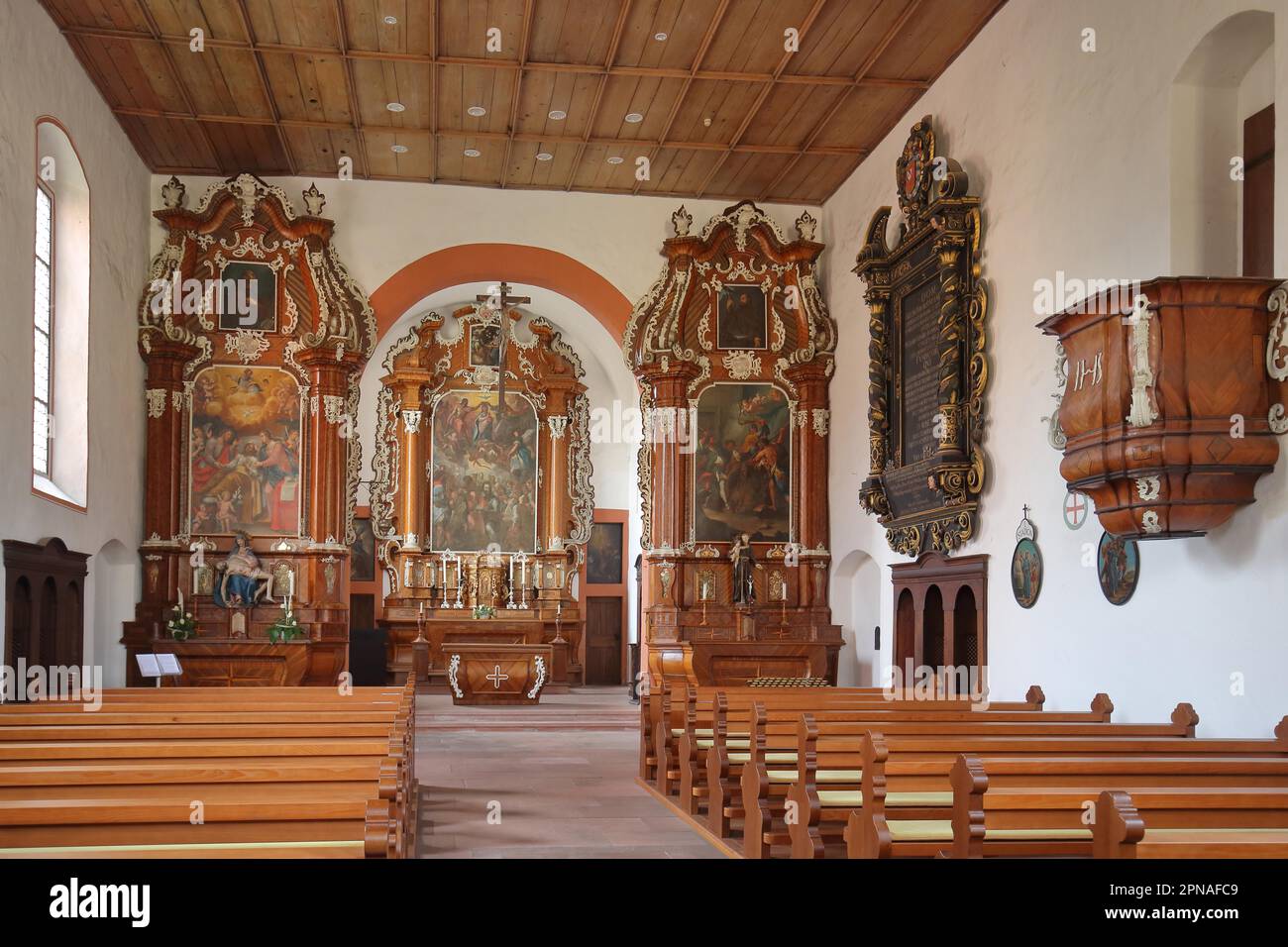 Interior view with pulpit and altar of the baroque monastery church ...