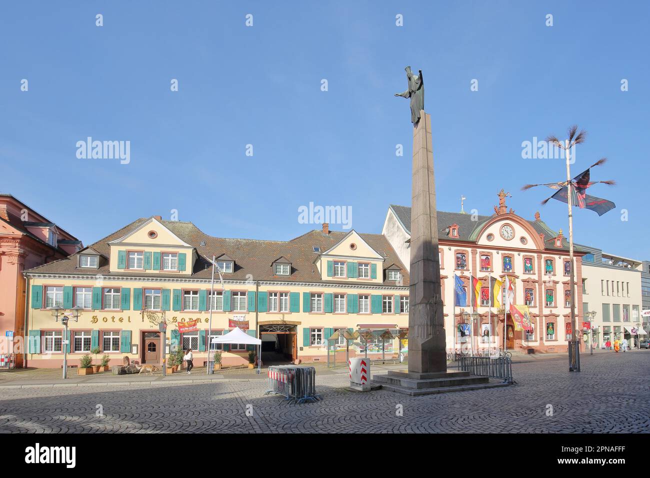 Baroque Hotel Sonne, town hall with flags and Ursula column as landmark ...