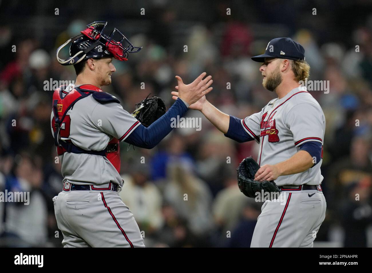Atlanta Braves relief pitcher A.J. Minter, right, celebrates with ...