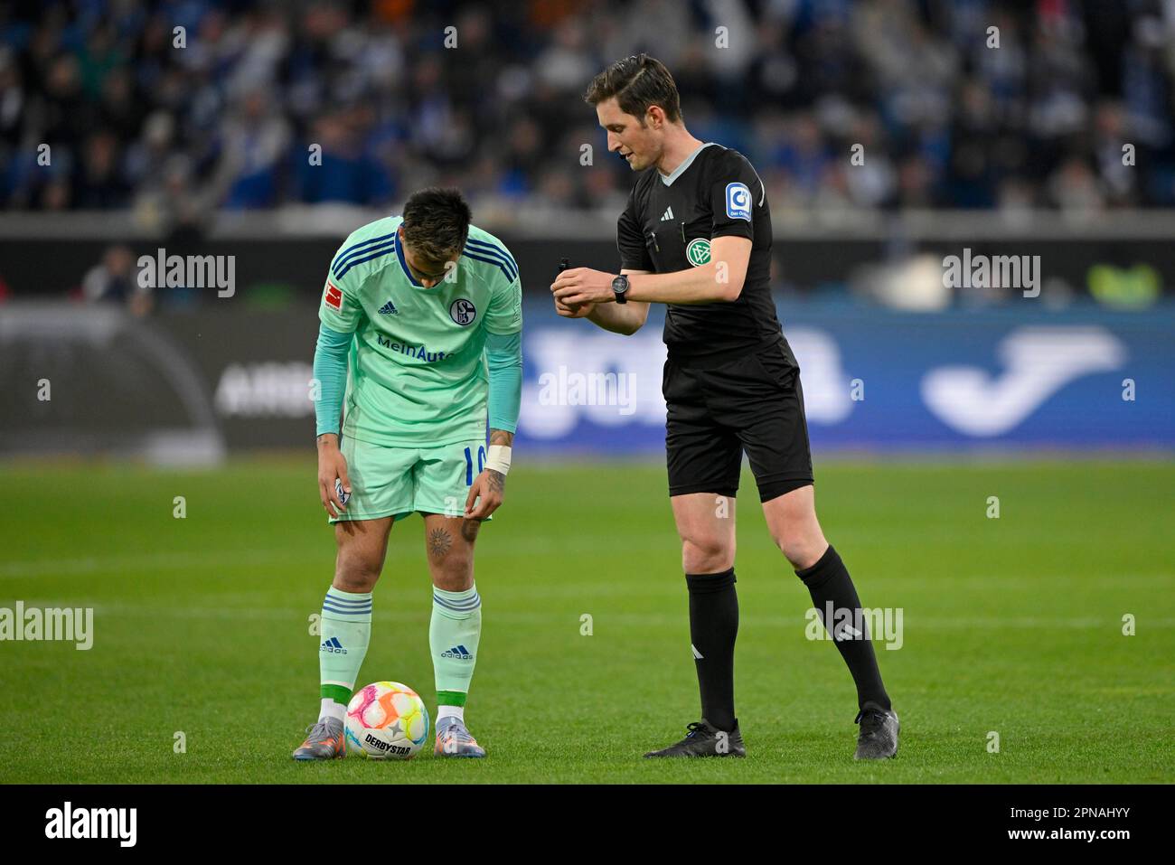 Referee Referee Dr Matthias Joellenbeck shows Rodrigo Zalazar FC ...