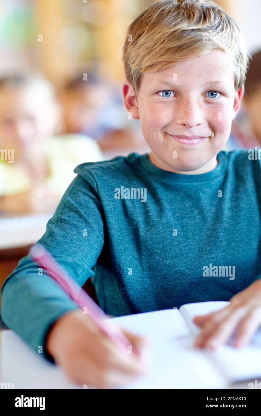 This is my favorite subject. Portrait of a young boy studying happily ...