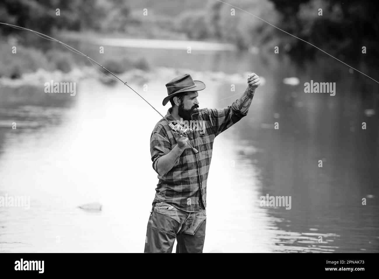Man fishing in pond Black and White Stock Photos & Images - Alamy