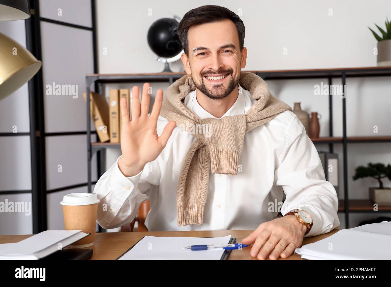 Male tutor giving online lesson at home Stock Photo - Alamy