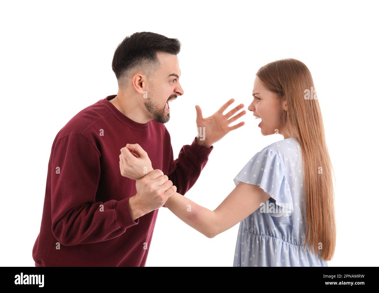 Angry young couple shouting on white background. Domestic violence ...