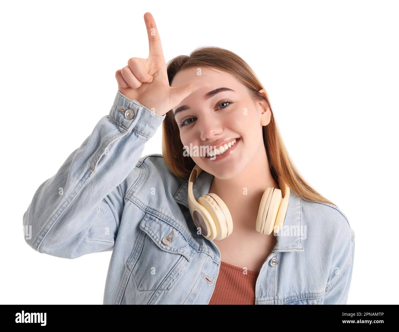 Young woman showing loser gesture on white background Stock Photo - Alamy