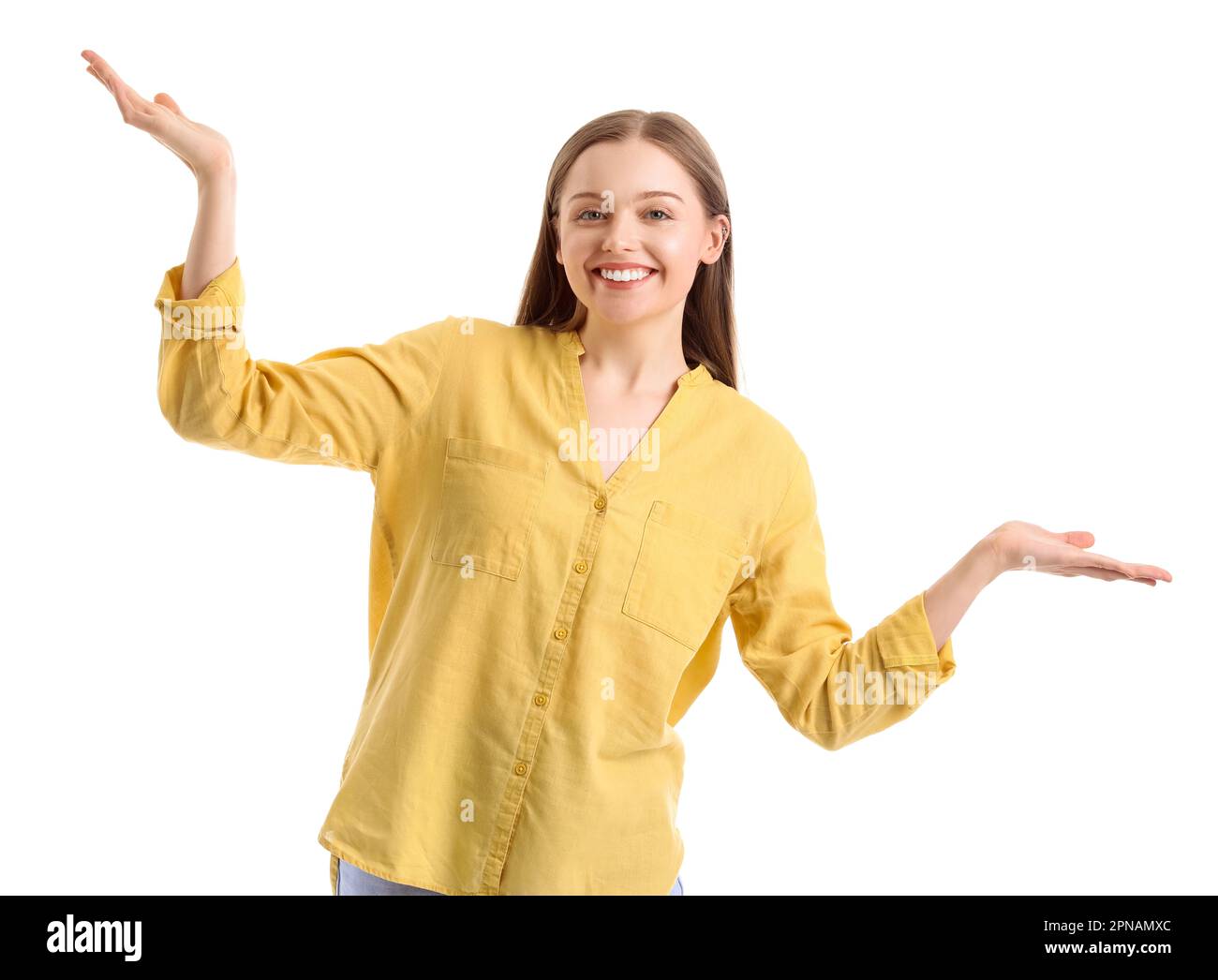 Young woman balancing on white background Stock Photo - Alamy