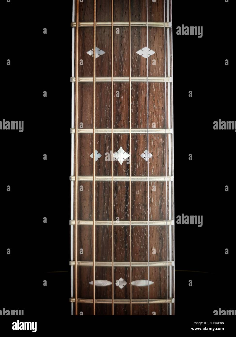 close up shot of fingerboard guitar , rosewood fingerboard with abalone ...